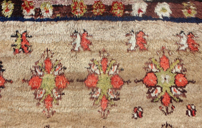 Angora Turkish Tulu Carpet with Colorful Floral Designs Set on Sand ...
