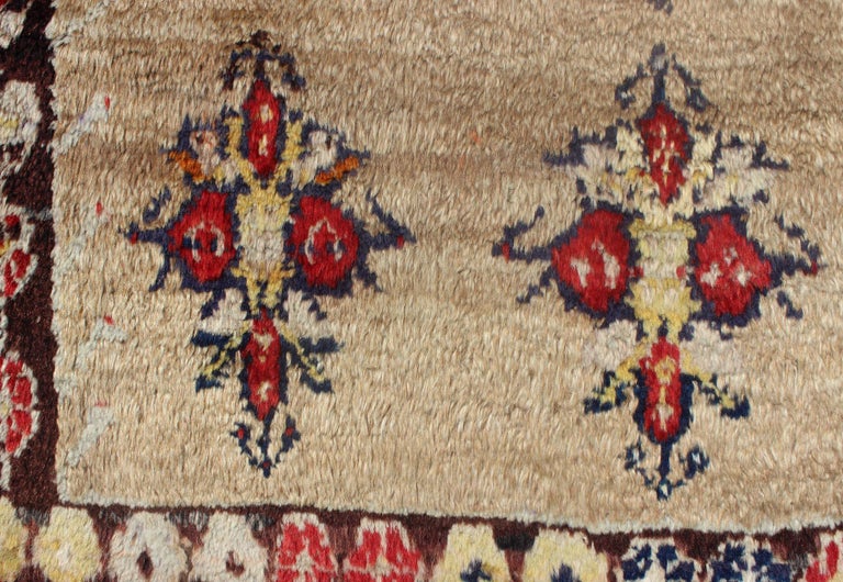 Angora Turkish Tulu Carpet with Colorful Floral Designs Set on Sand ...