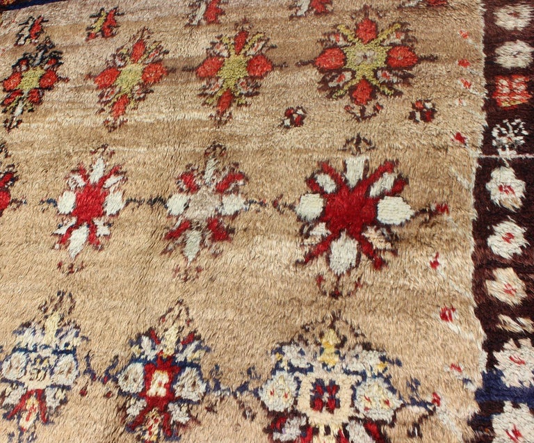 Angora Turkish Tulu Carpet with Colorful Floral Designs Set on Sand ...