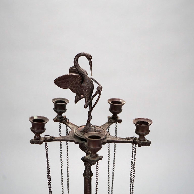 Candélabre ancien en bronze figuratif avec masque de héron et de lion ...