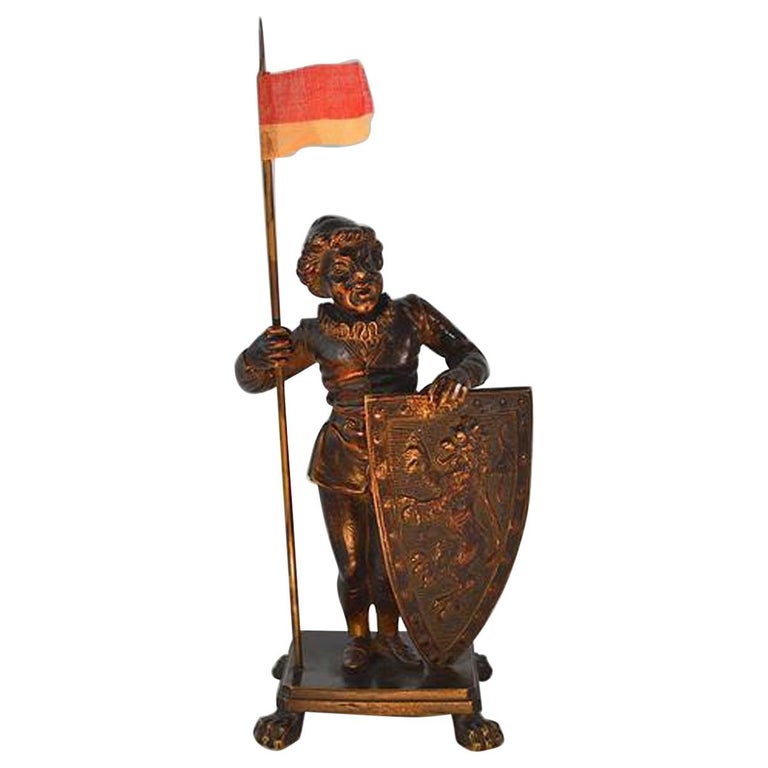 Antique Bronze Figure of a Medieval Man Holding a Flag For Sale at 1stDibs