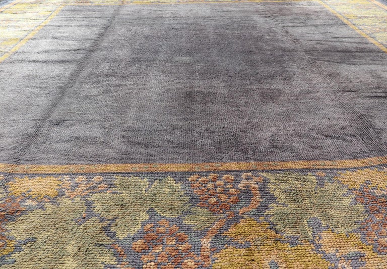 Antique Irish Donegal Carpet in solid Purple Background and Floral ...