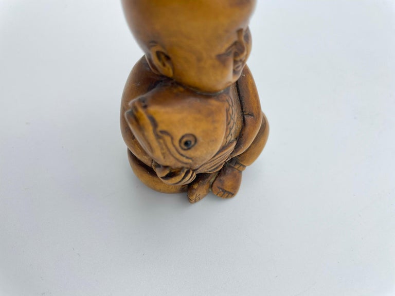 Antique Japanese Wooden Netsuke 'Boy with Fish' 1930s at 1stDibs