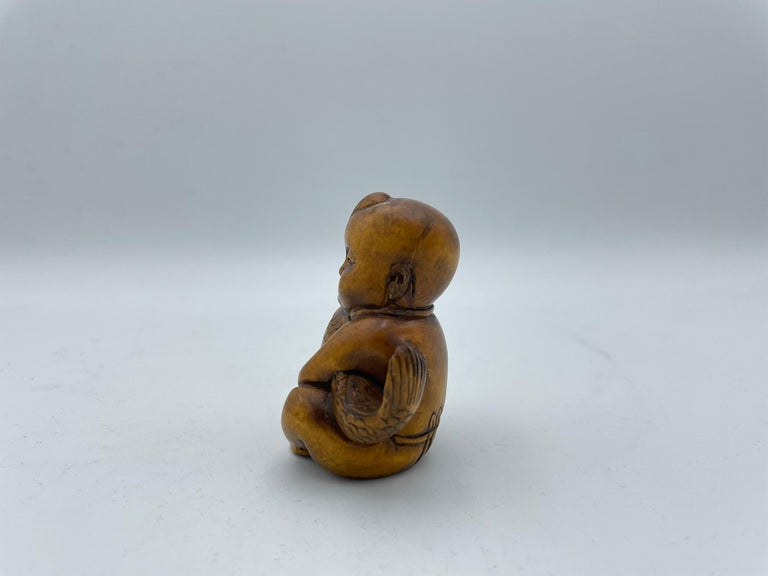 Antique Japanese Wooden Netsuke 'Boy with Fish' 1930s at 1stDibs