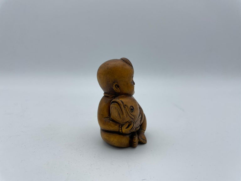 Antique Japanese Wooden Netsuke 'Boy with Fish' 1930s at 1stDibs