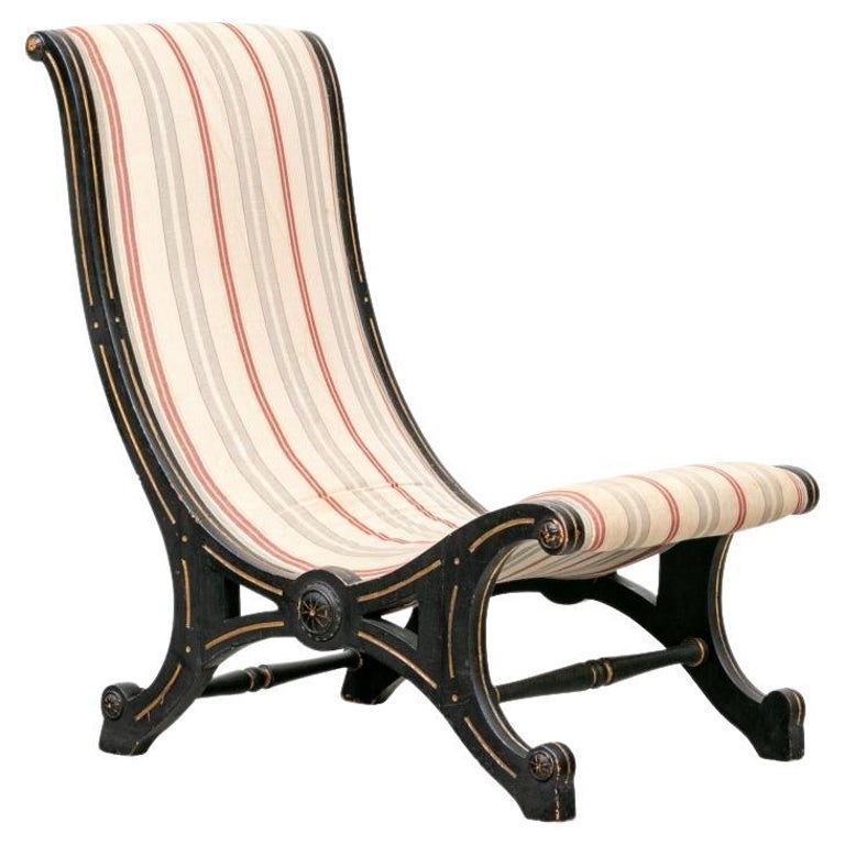 Antique Neoclassical Style Ebonized and Gilt Lolling Chair For Sale at ...