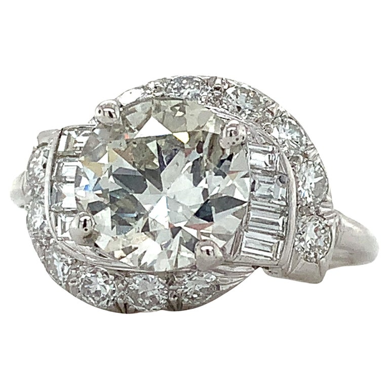 Antique Platinum European Cut Center W/ Baguette and Round Cut Diamonds ...