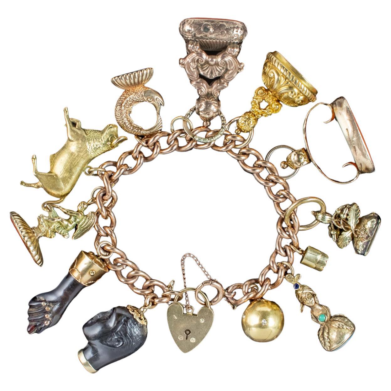 Antique Victorian Charm Bracelet With 12 Charms And Fobs For Sale at 1stDibs
