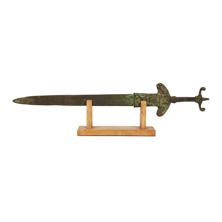 Archaic Styled Bronze Sword with Figures on Stand For Sale at 1stdibs