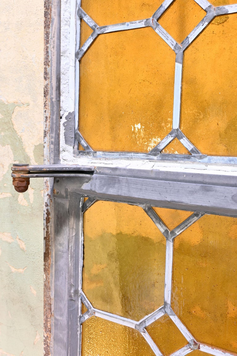 Arched Iron Framed French Window with Yellow Glass For Sale at 1stDibs