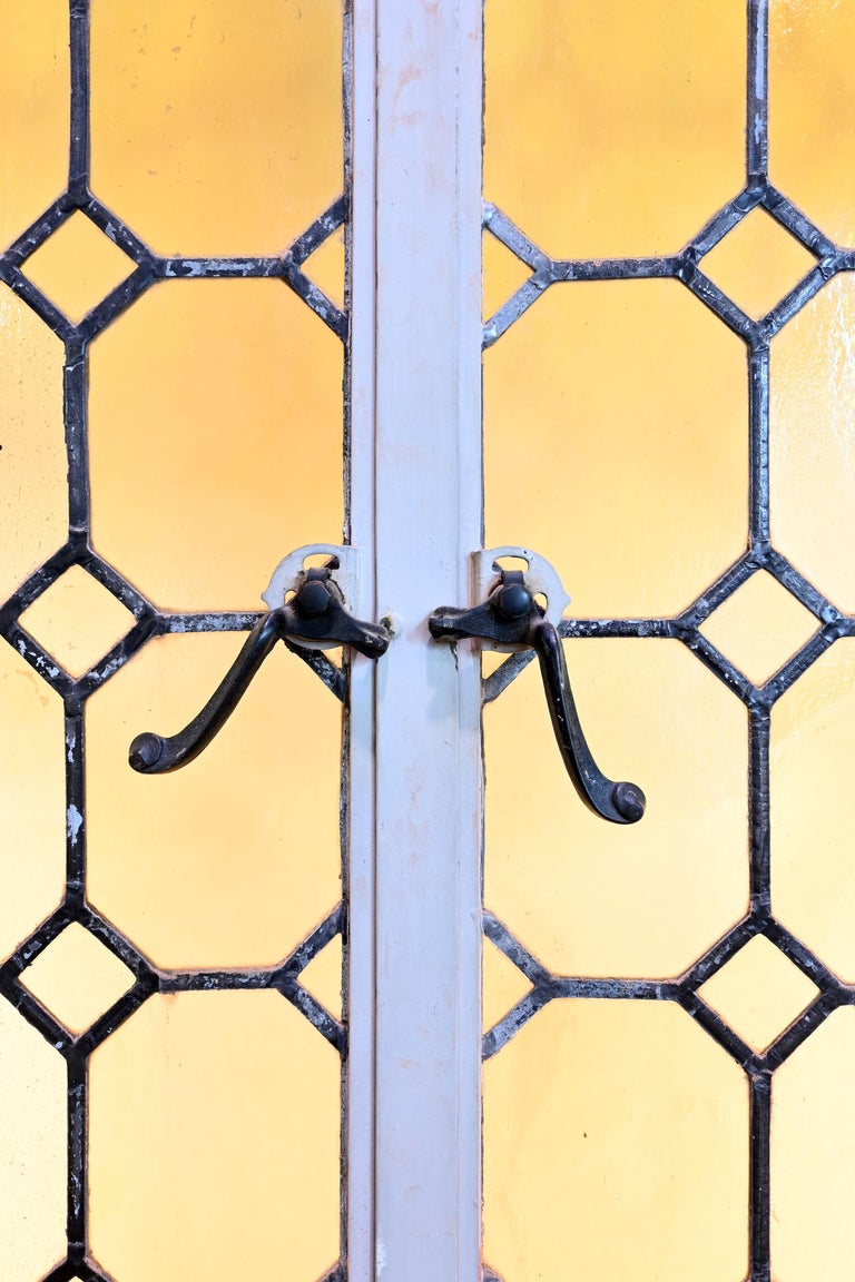 Arched Iron Framed French Window with Yellow Glass For Sale at 1stDibs