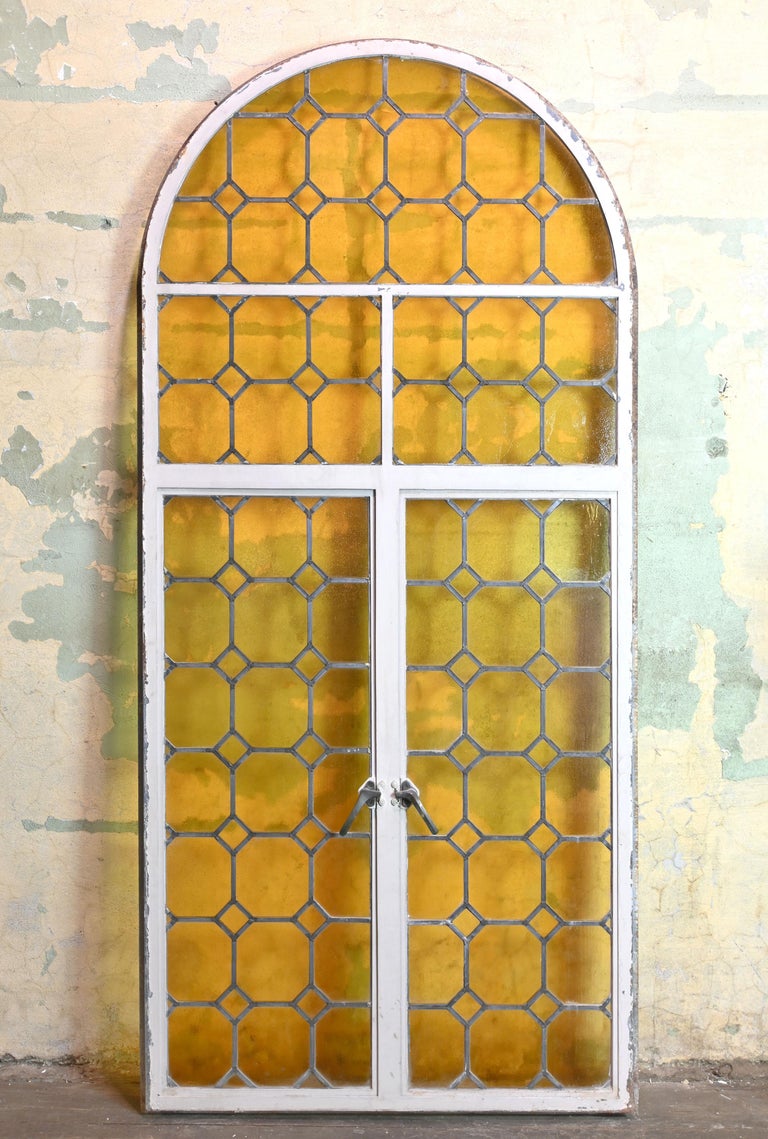 Arched Iron Framed French Window with Yellow Glass For Sale at 1stDibs