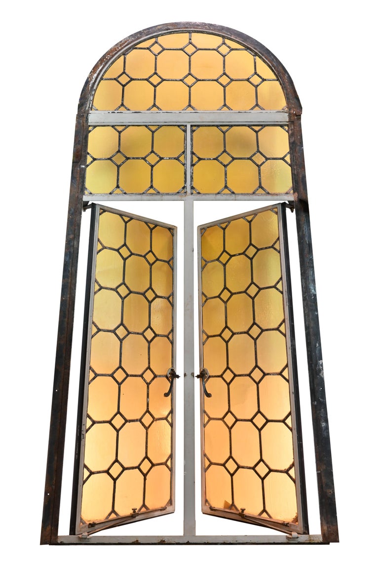 Arched Iron Framed French Window with Yellow Glass For Sale at 1stDibs