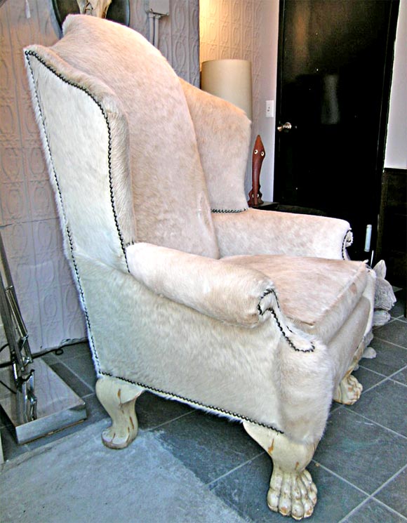 Cowhide-covered wingback chair For Sale at 1stDibs