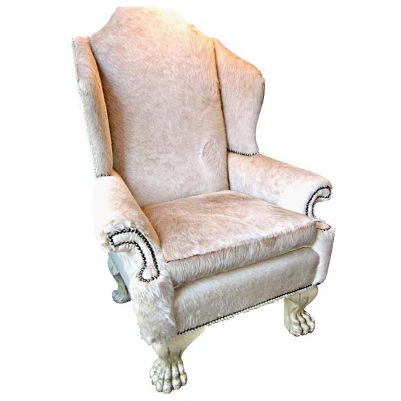 Cowhide-covered wingback chair For Sale at 1stDibs