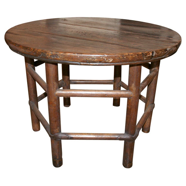 A low round table with Hexagonal base stretcher in walnut at 1stDibs