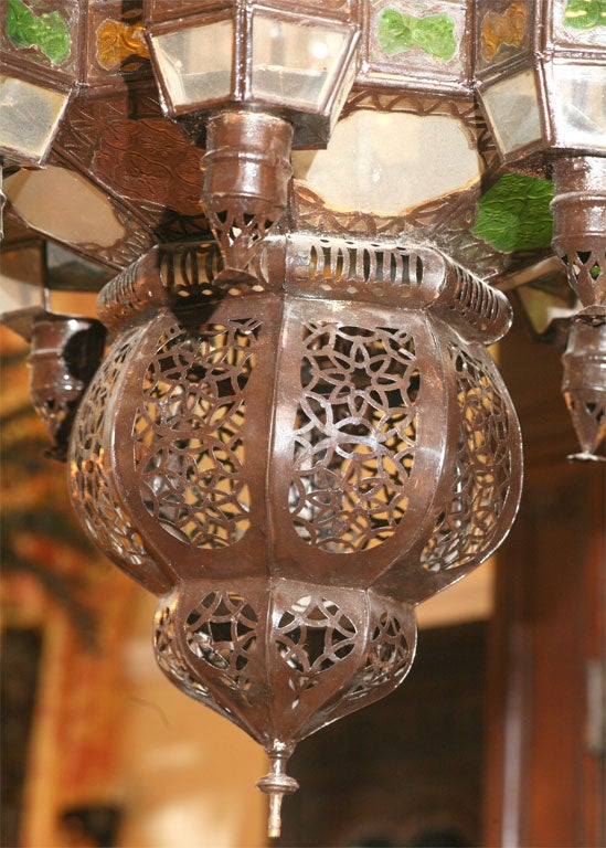 A MOROCCAN LANTERN WITH 3 LIGHTS IN THE CENTER at 1stDibs