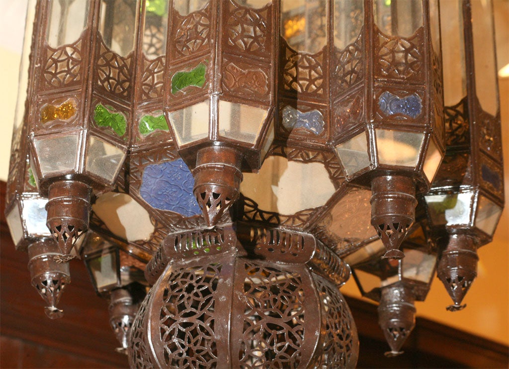 A MOROCCAN LANTERN WITH 3 LIGHTS IN THE CENTER at 1stDibs