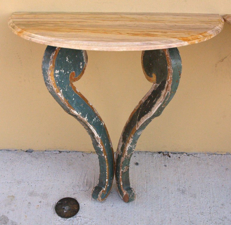 Pair of demi-lune, wall mounted console tables at 1stDibs