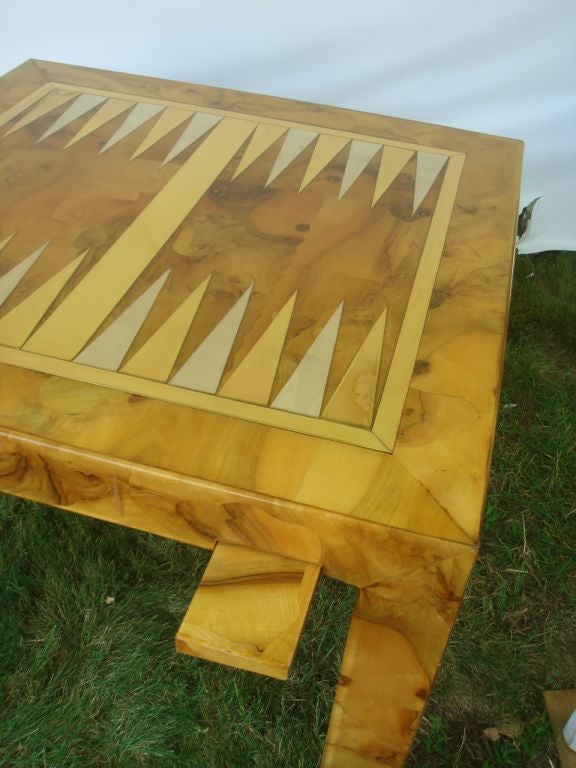 An Olive-wood Burl Games Table with inset Metal Backgammon Board at ...