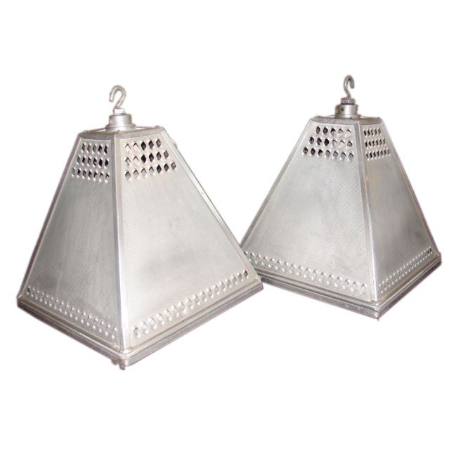 Pair of pierced aluminium light fixtures at 1stDibs