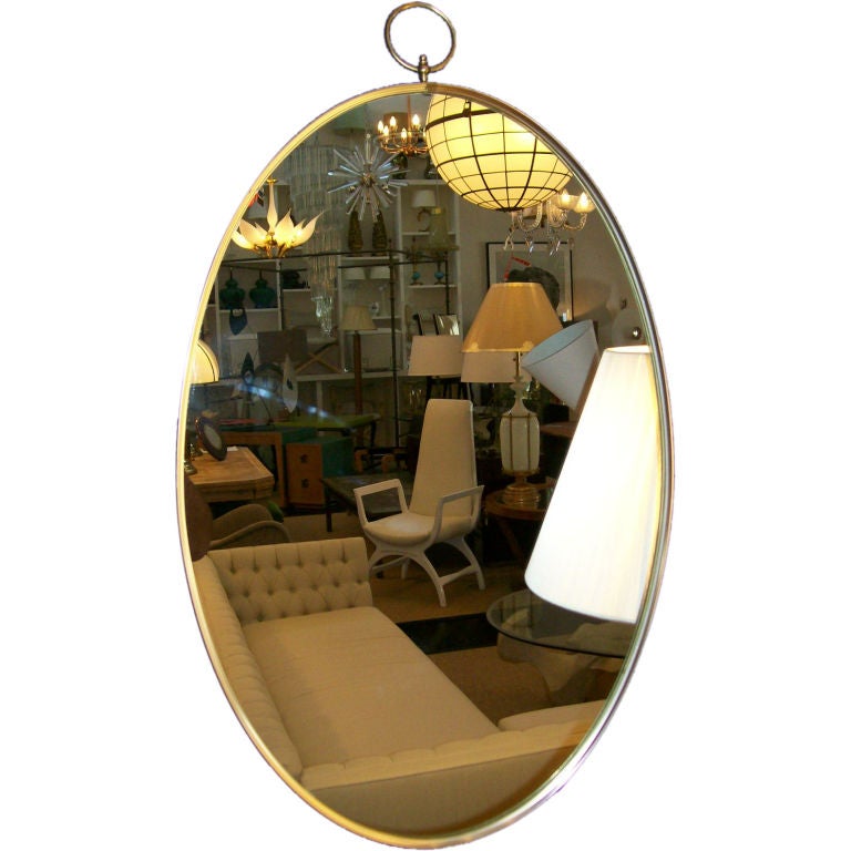 An Oval Mirror with Decorative Hanging Loop at 1stDibs