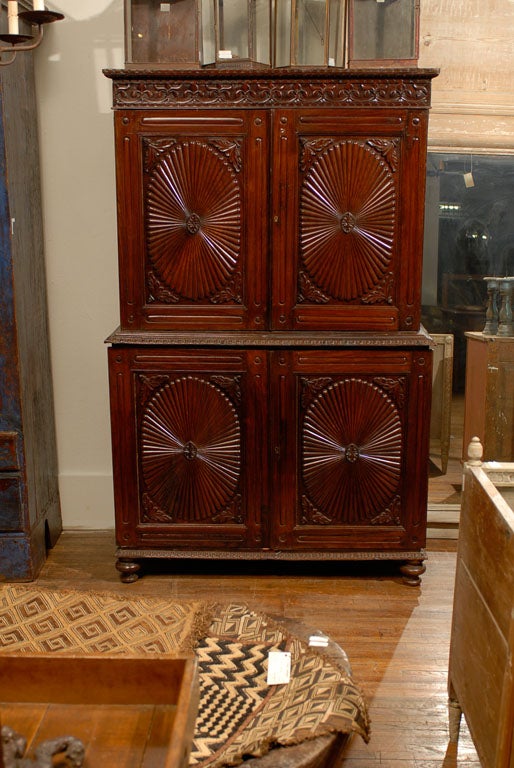 A 19th Century British Colonial Cabinet with Oval Patterns at 1stDibs