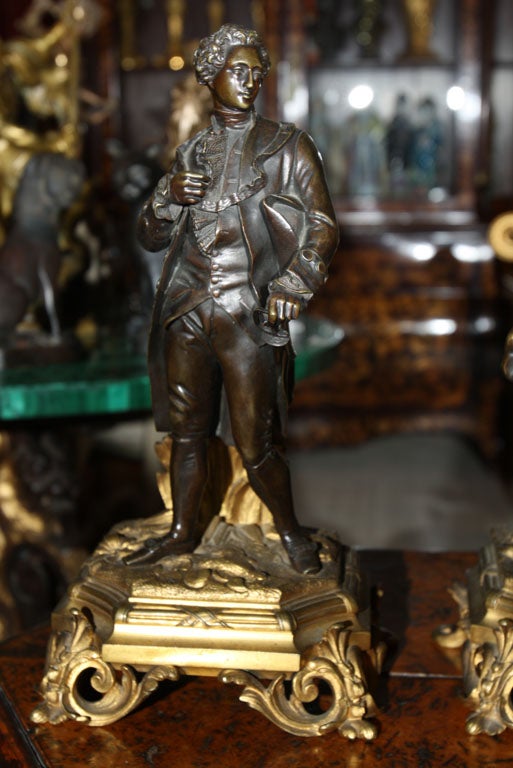 A Pair of Patinated Bronze Figures of a Male and Female For Sale at 1stDibs