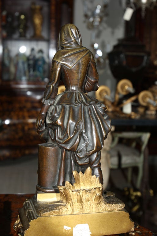 A Pair of Patinated Bronze Figures of a Male and Female For Sale at 1stDibs