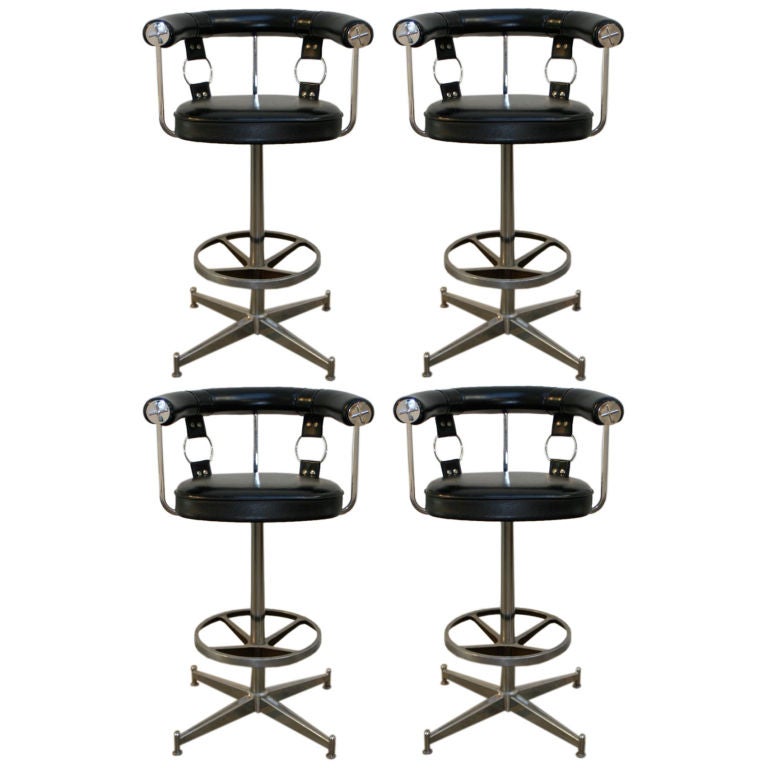 Pair of swivel bar stools with strap details at 1stDibs