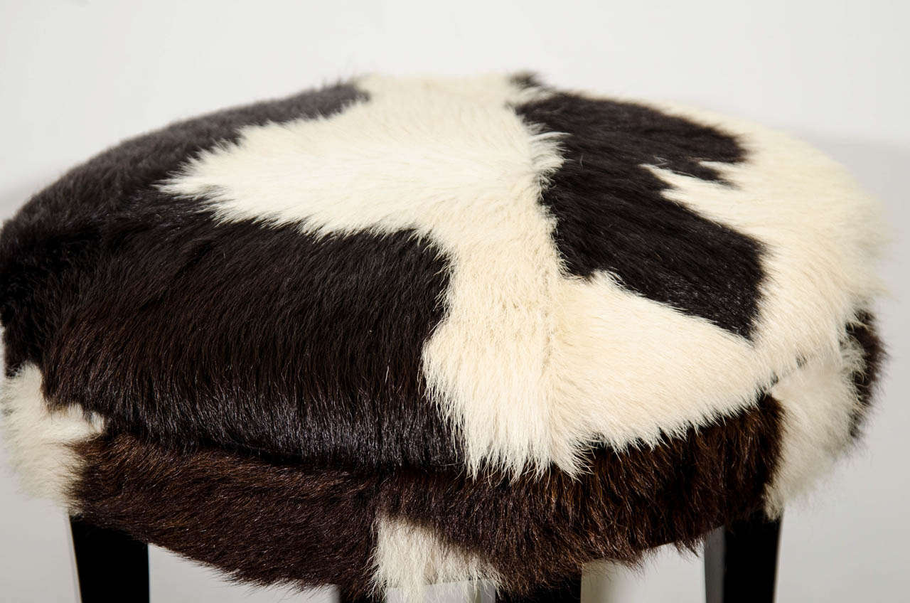 A Mid Century Stool with Cow Hide Upholstery and Ebonized Legs at 1stDibs