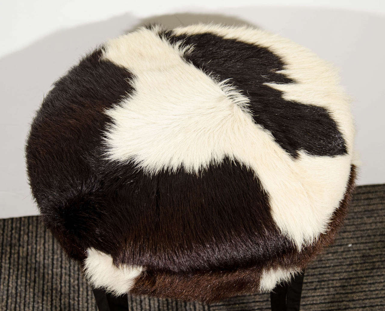 A Mid Century Stool with Cow Hide Upholstery and Ebonized Legs at 1stDibs