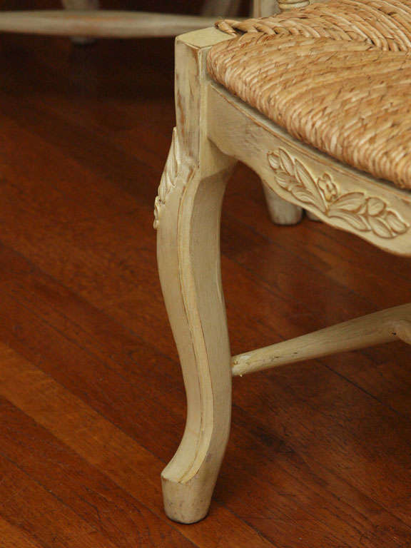 Set of eight French provincial painted rush seat chairs. at 1stDibs