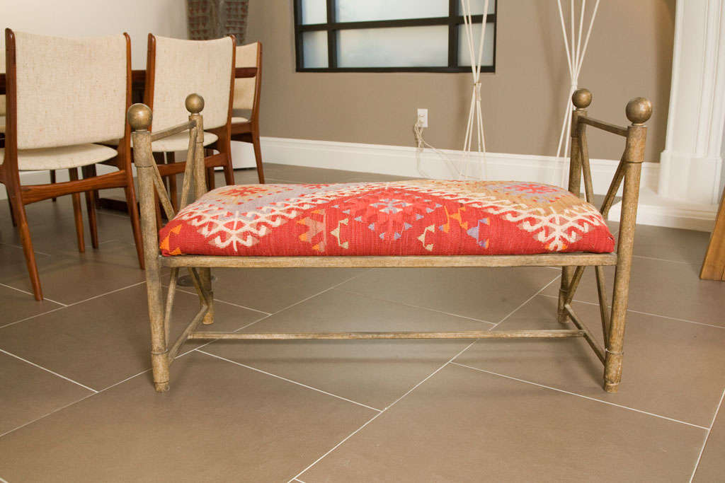 Vintage metal bench covered in 100 year old kilm rug at 1stDibs