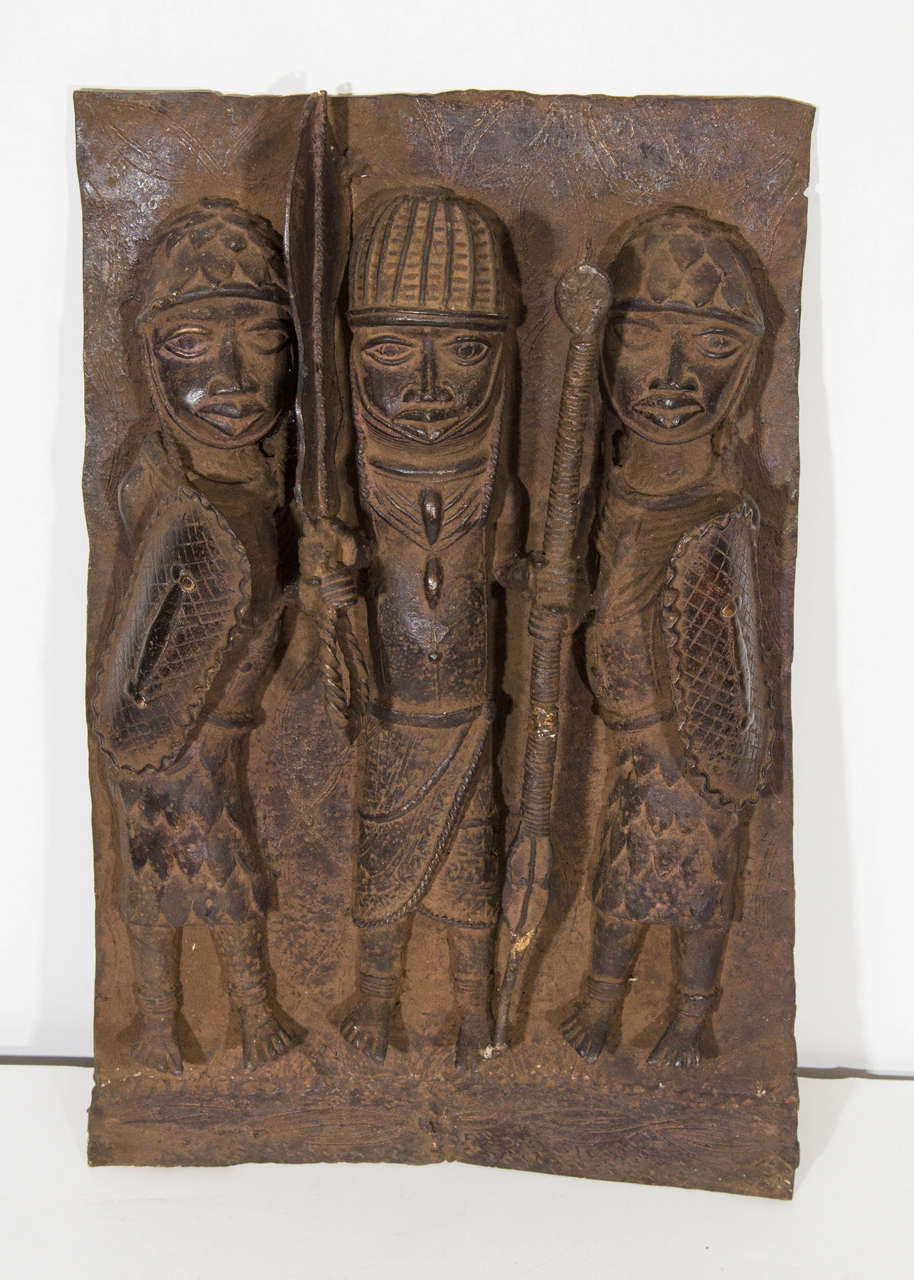 Reproduction Benin Plaque Depicting Figures Holding Shields and Weapons ...