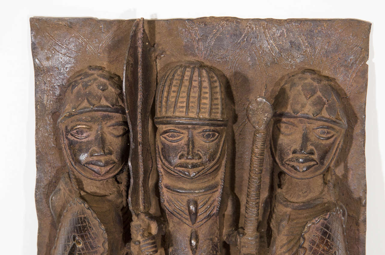 Reproduction Benin Plaque Depicting Figures Holding Shields and Weapons ...