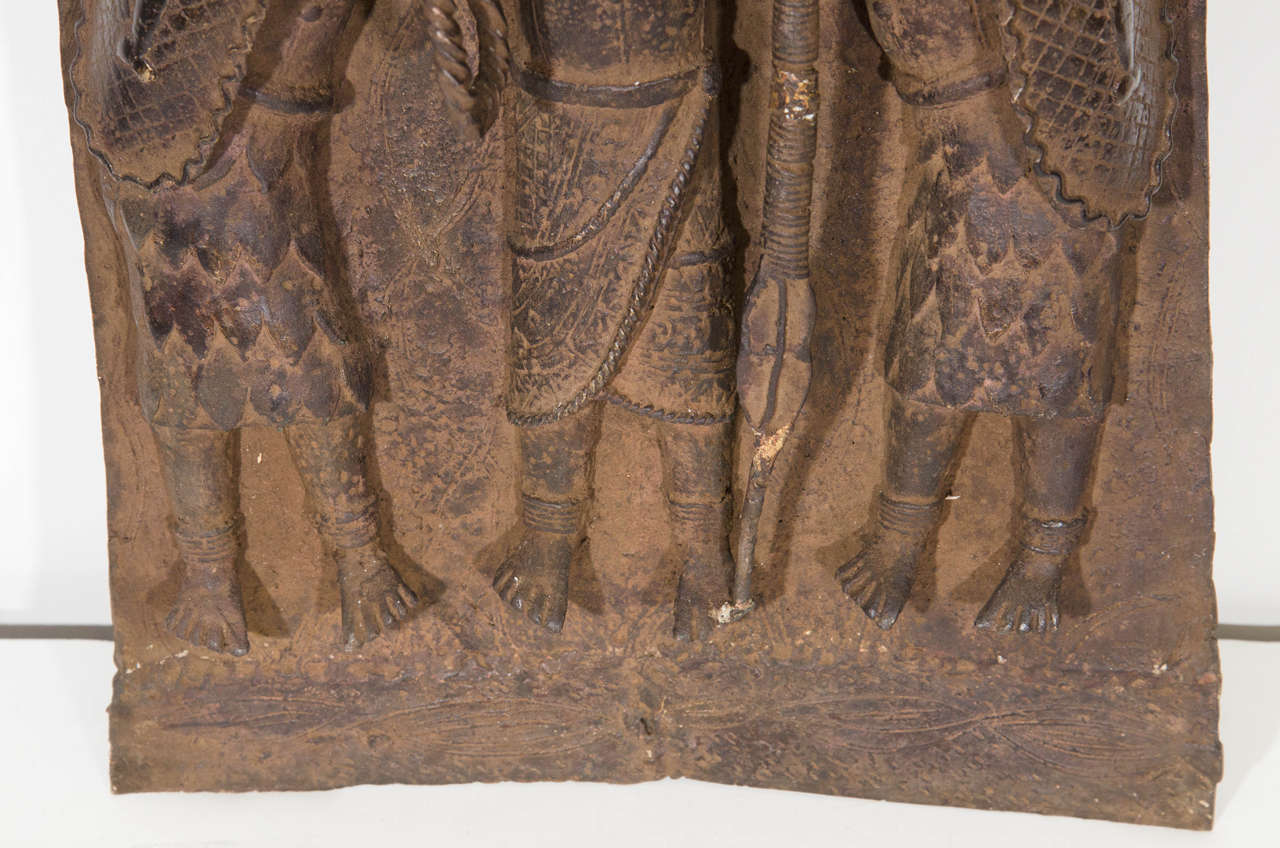 Reproduction Benin Plaque Depicting Figures Holding Shields and Weapons ...