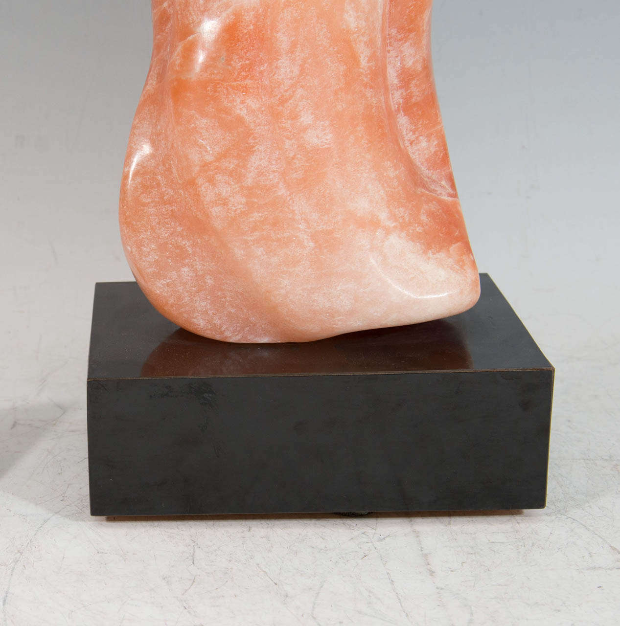 A Coral Colored Stone Sculpture with Revolving Base, Signed ESR at 1stDibs