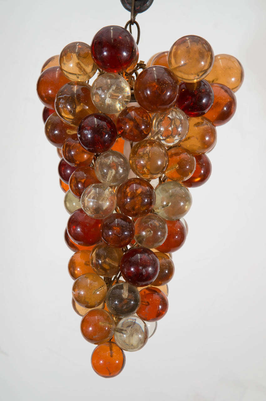 A Mid Century Grape Cluster Light with Iron Stand at 1stDibs