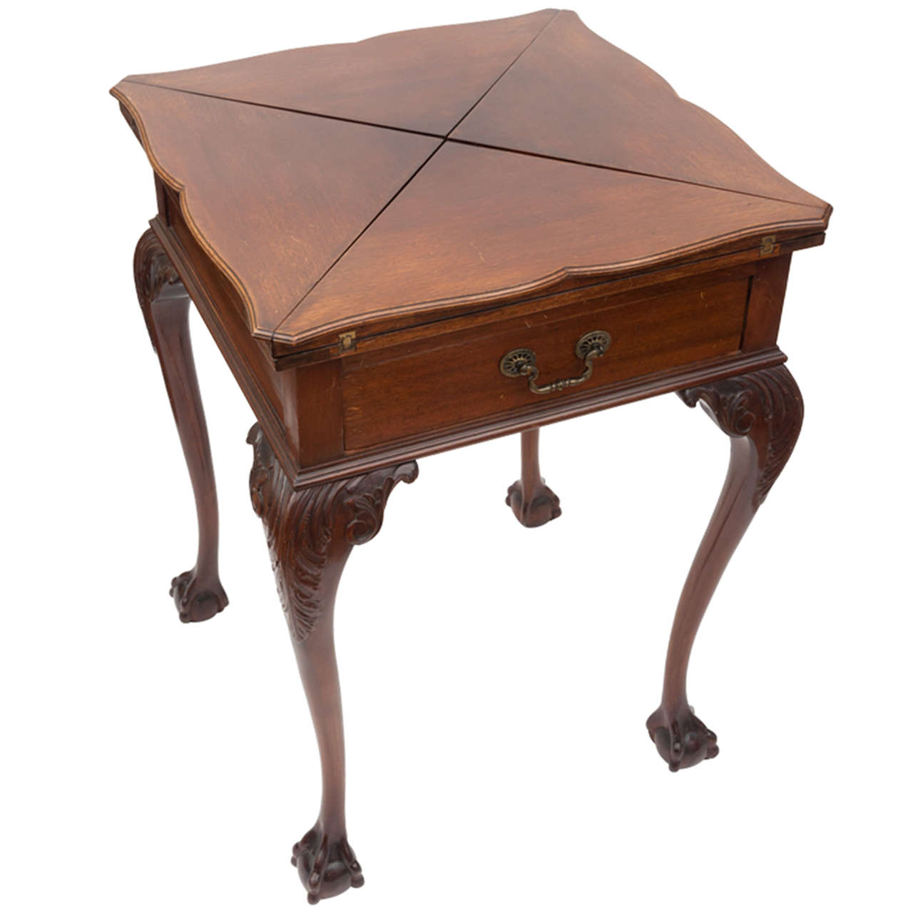 An Edwardian period ‘Centennial’ mahogany swivel and fold-over top card ...