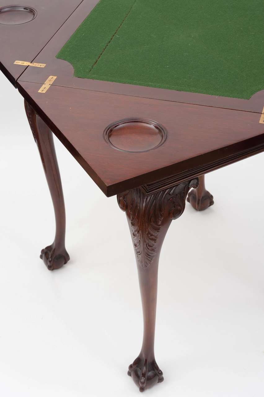 An Edwardian period ‘Centennial’ mahogany swivel and fold-over top card ...