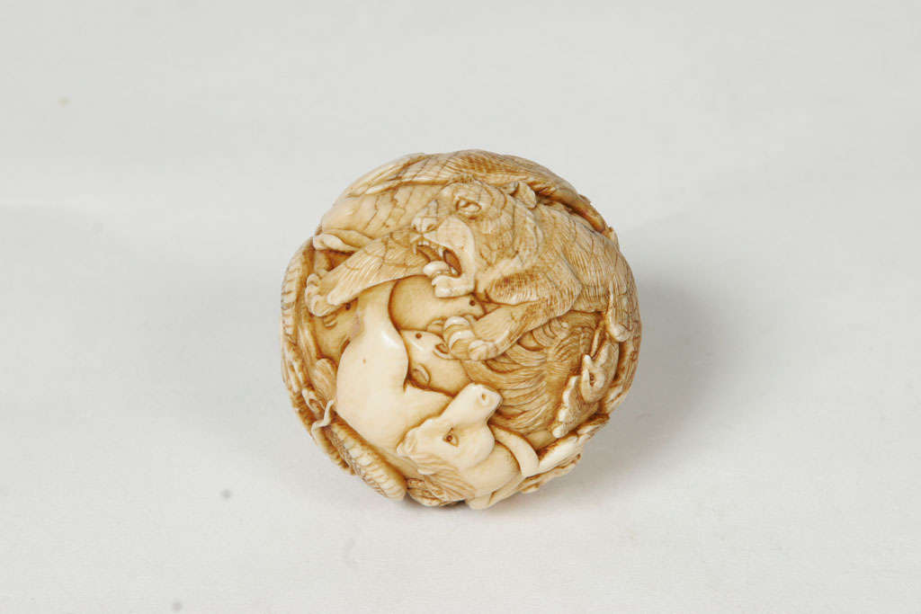 A 19th century Japanese Ivory spherical Okimono. at 1stDibs