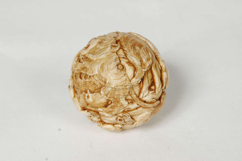 A 19th century Japanese Ivory spherical Okimono. at 1stDibs