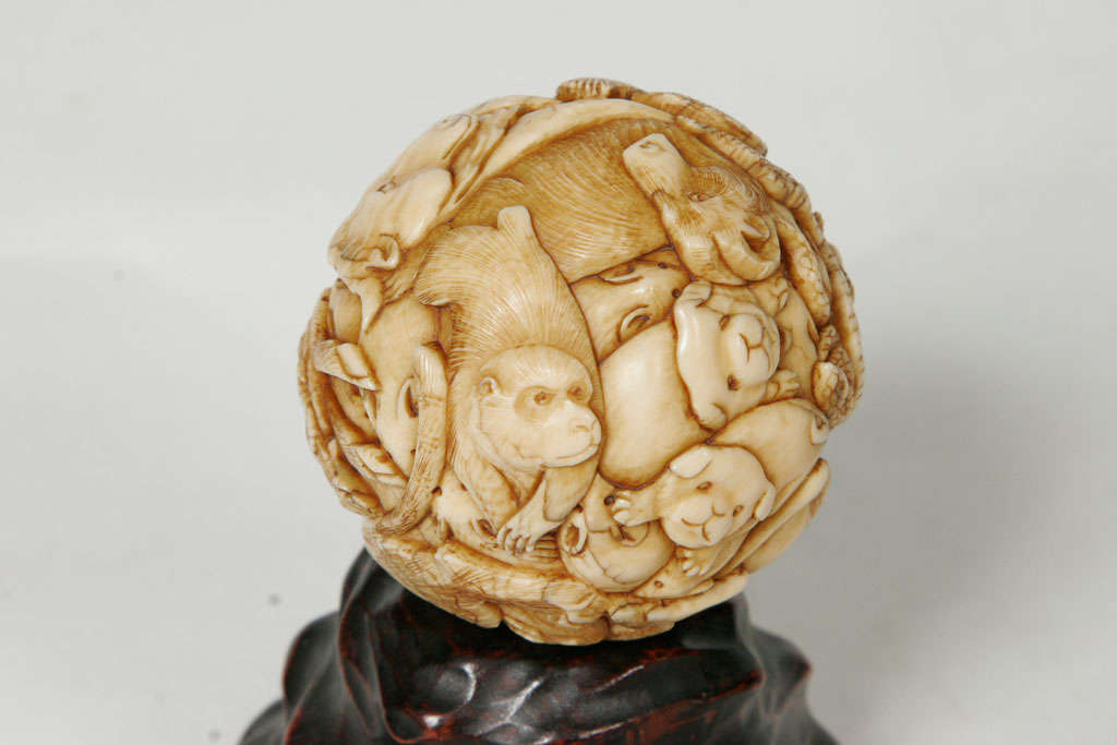A 19th century Japanese Ivory spherical Okimono. at 1stDibs