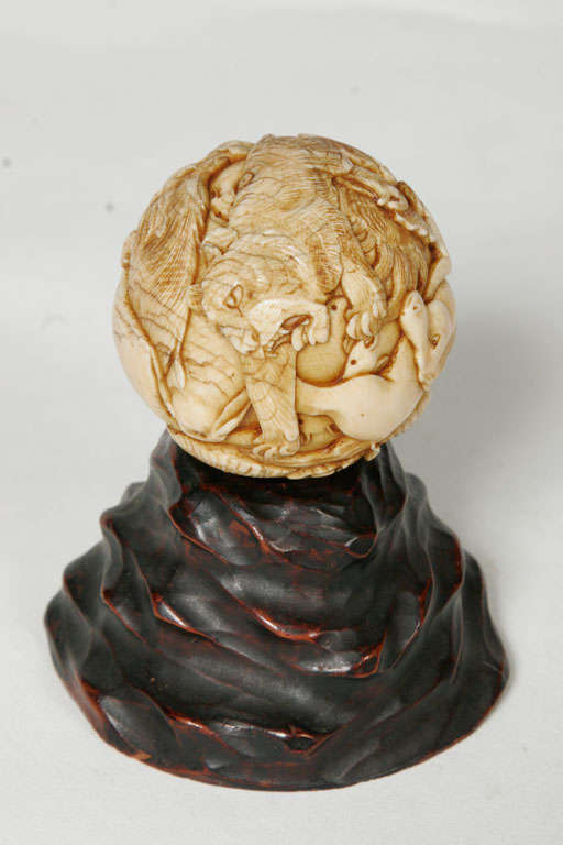 A 19th century Japanese Ivory spherical Okimono. at 1stDibs