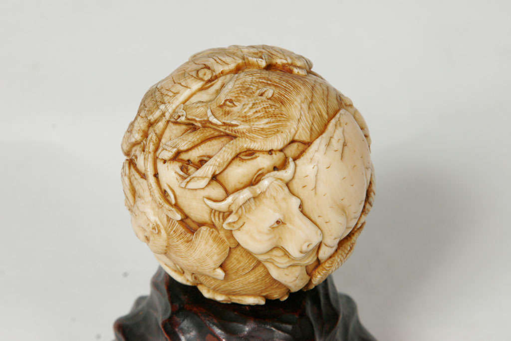 A 19th century Japanese Ivory spherical Okimono. at 1stDibs