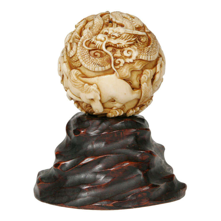 A 19th century Japanese Ivory spherical Okimono. at 1stDibs