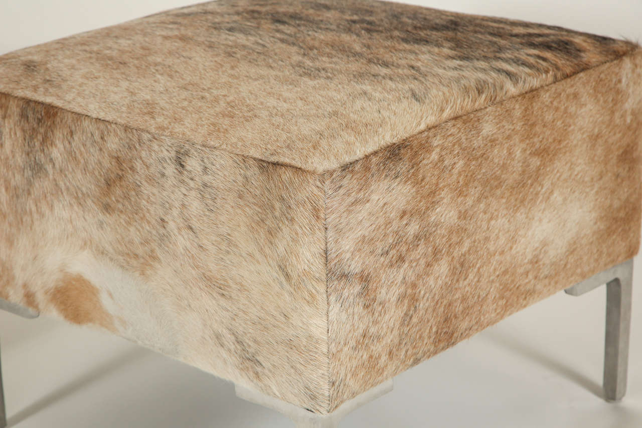 Pair of Cowhide Ottomans at 1stDibs
