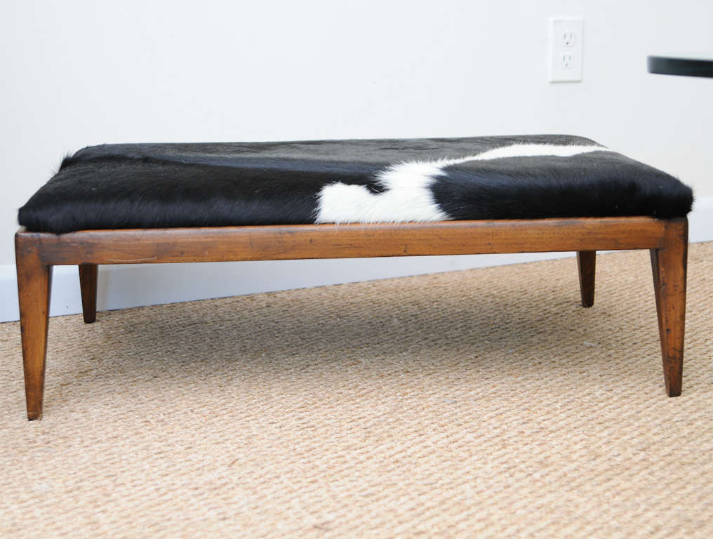 Oversized Cowhide Footstool at 1stDibs