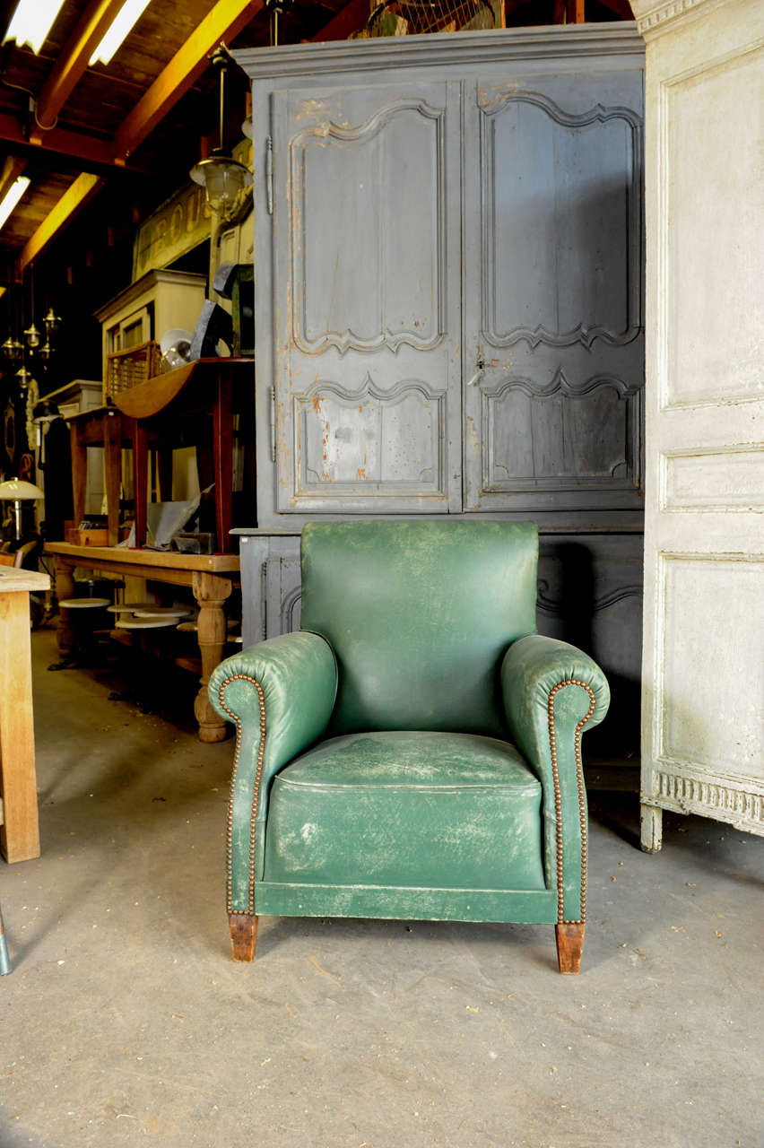 A pair of antique green leather club seats at 1stDibs